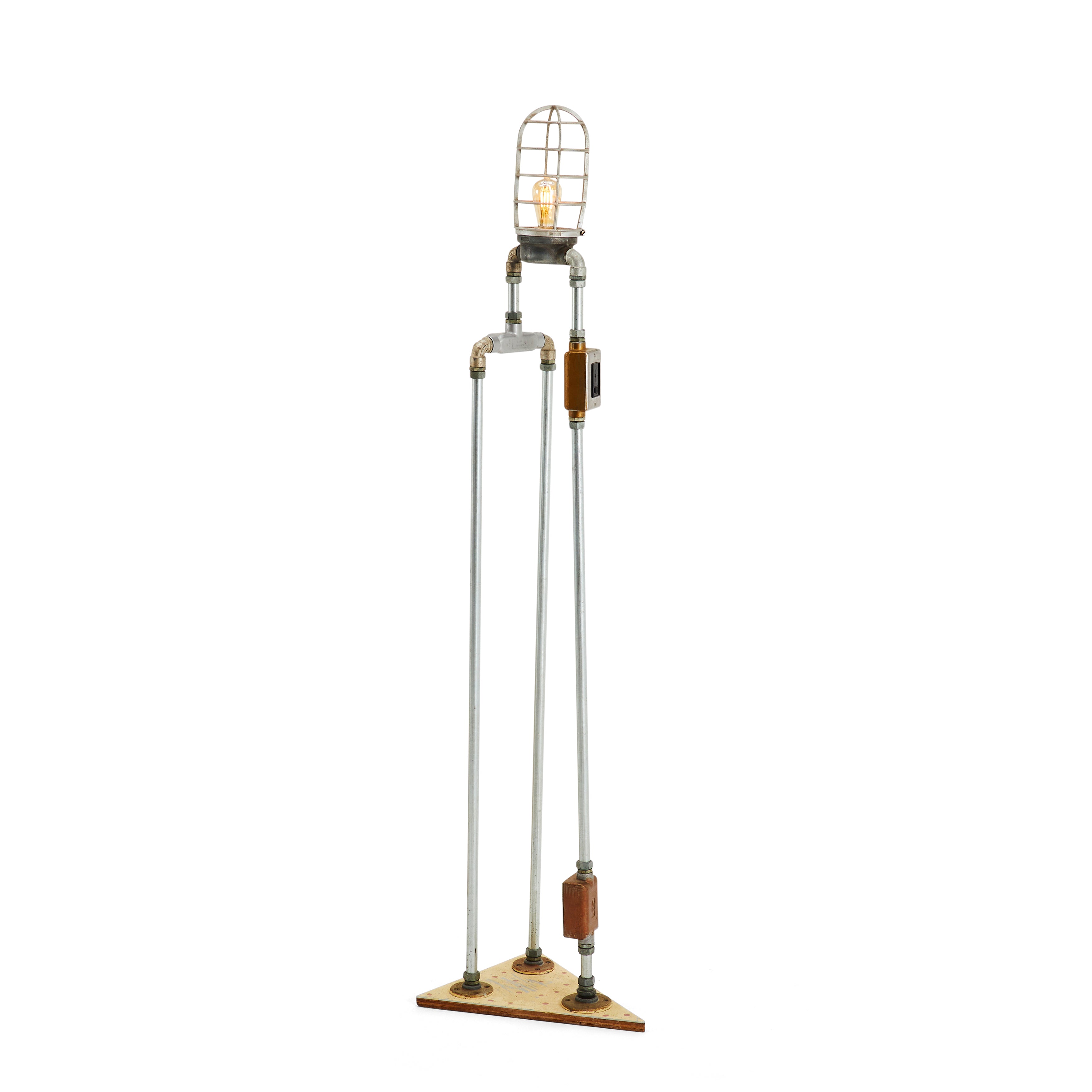 Grey Metal Industrial Triangle Pipe Floor Lamp - Gil & Roy Props