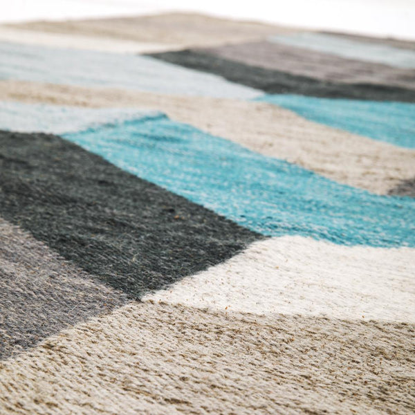 Graphic Grey and Blue Arrow Rug - Gil & Roy Props